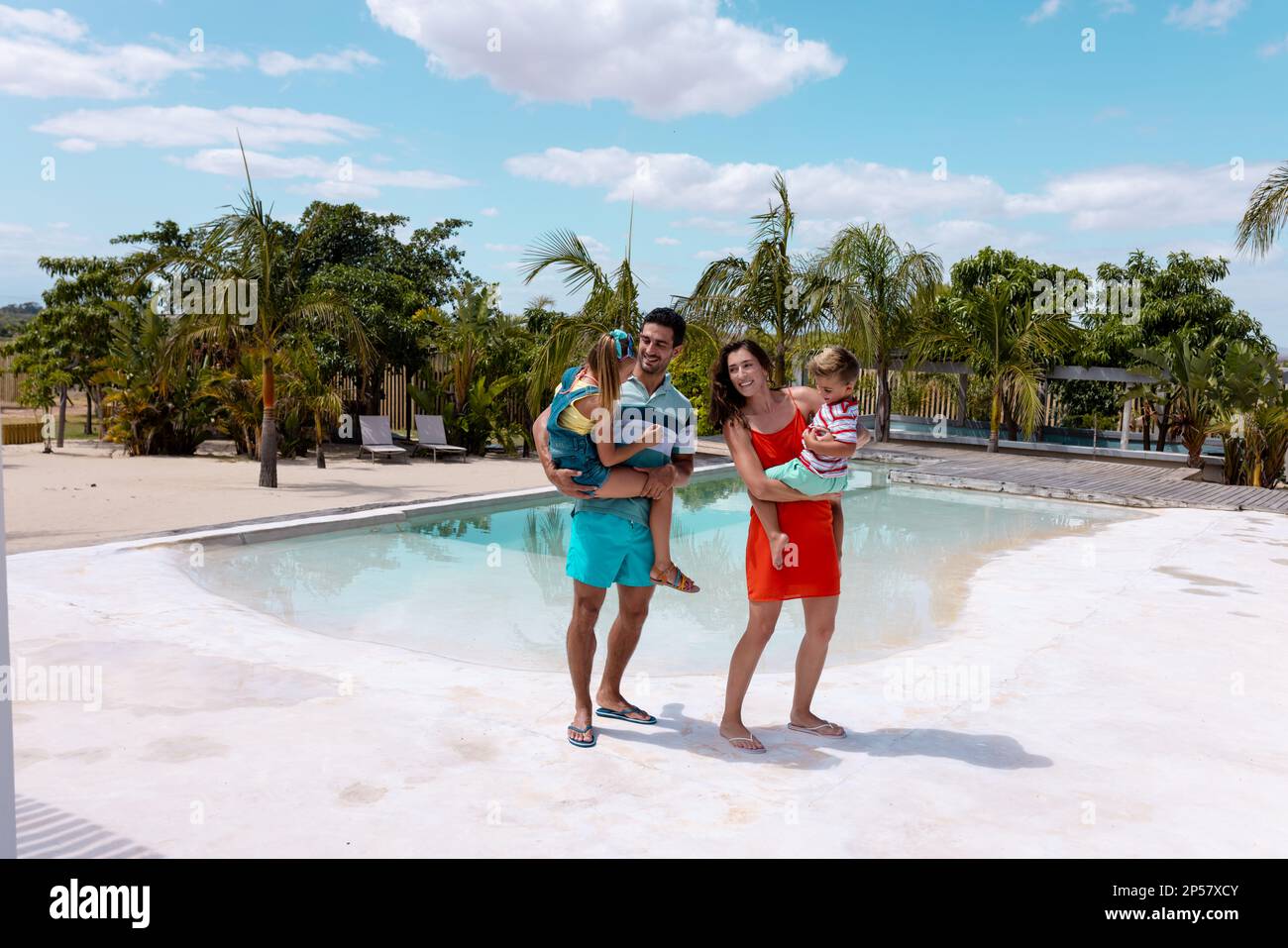 Family by the pool hi-res stock photography and images - Alamy
