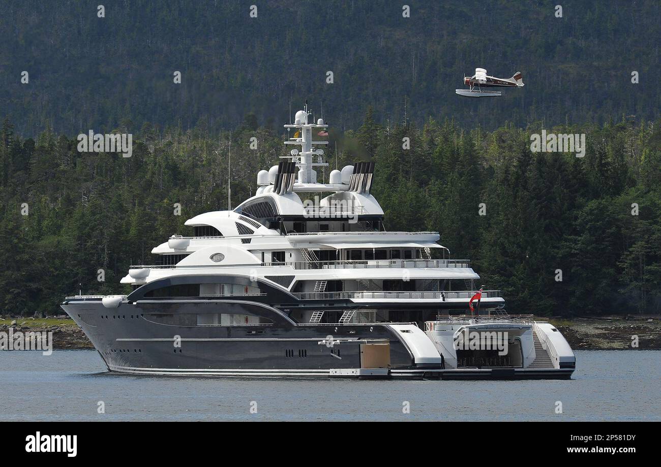 A float plane flies over the super yacht Serene during take off in ...