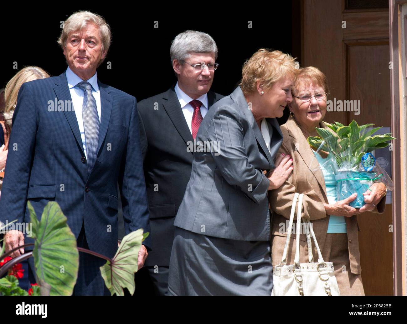 Quebec Premier Pauline Marois, center right, comforts her mother Marie ...