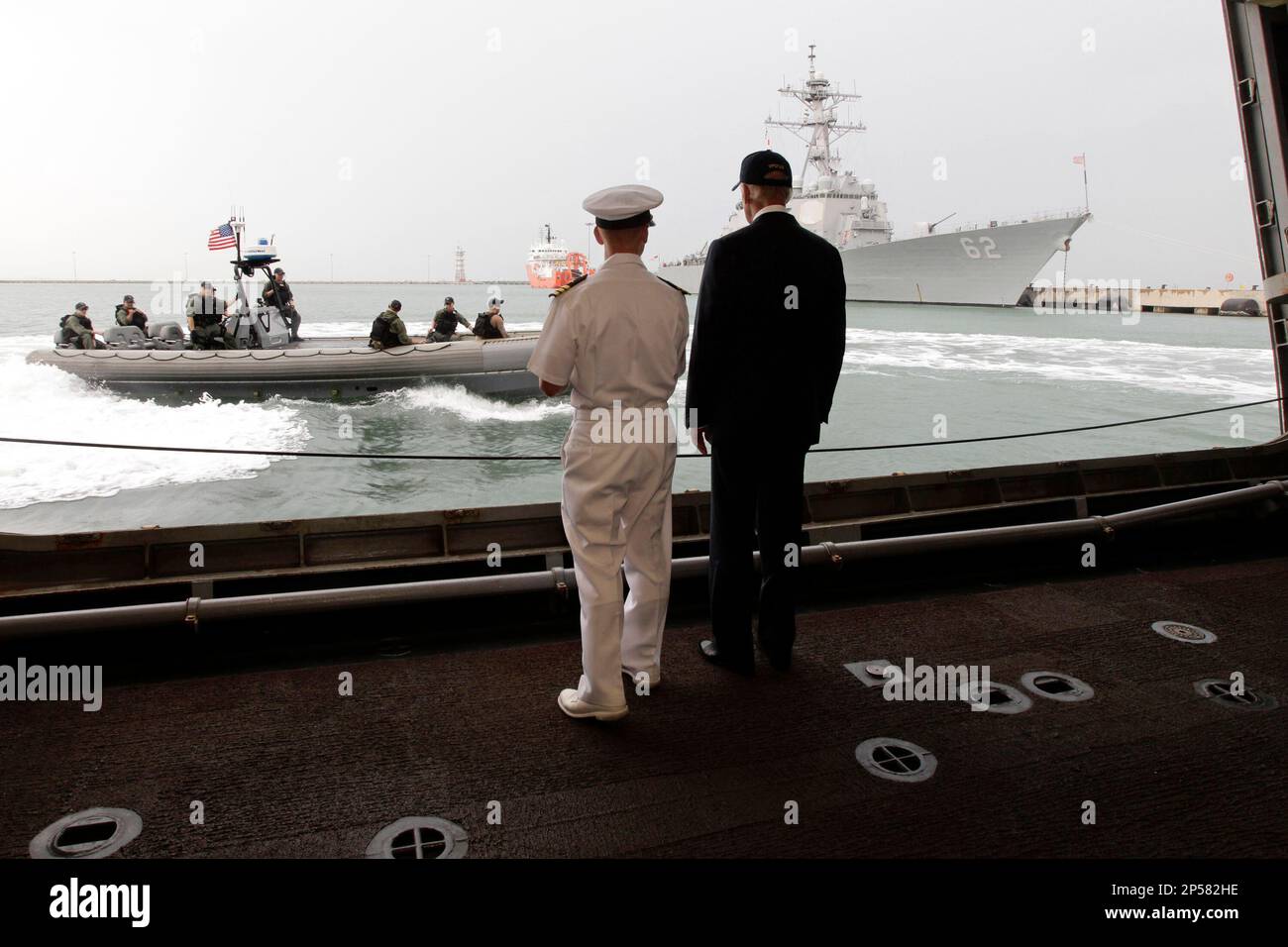 U.S. Vice President Joe Biden, right, watches a maneuver with Cmdr. Tim ...