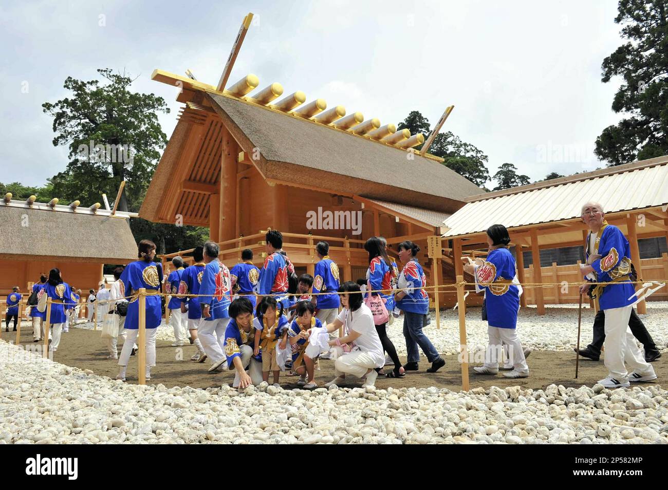 White stone are laid out on the ground around the new Shoden main ...