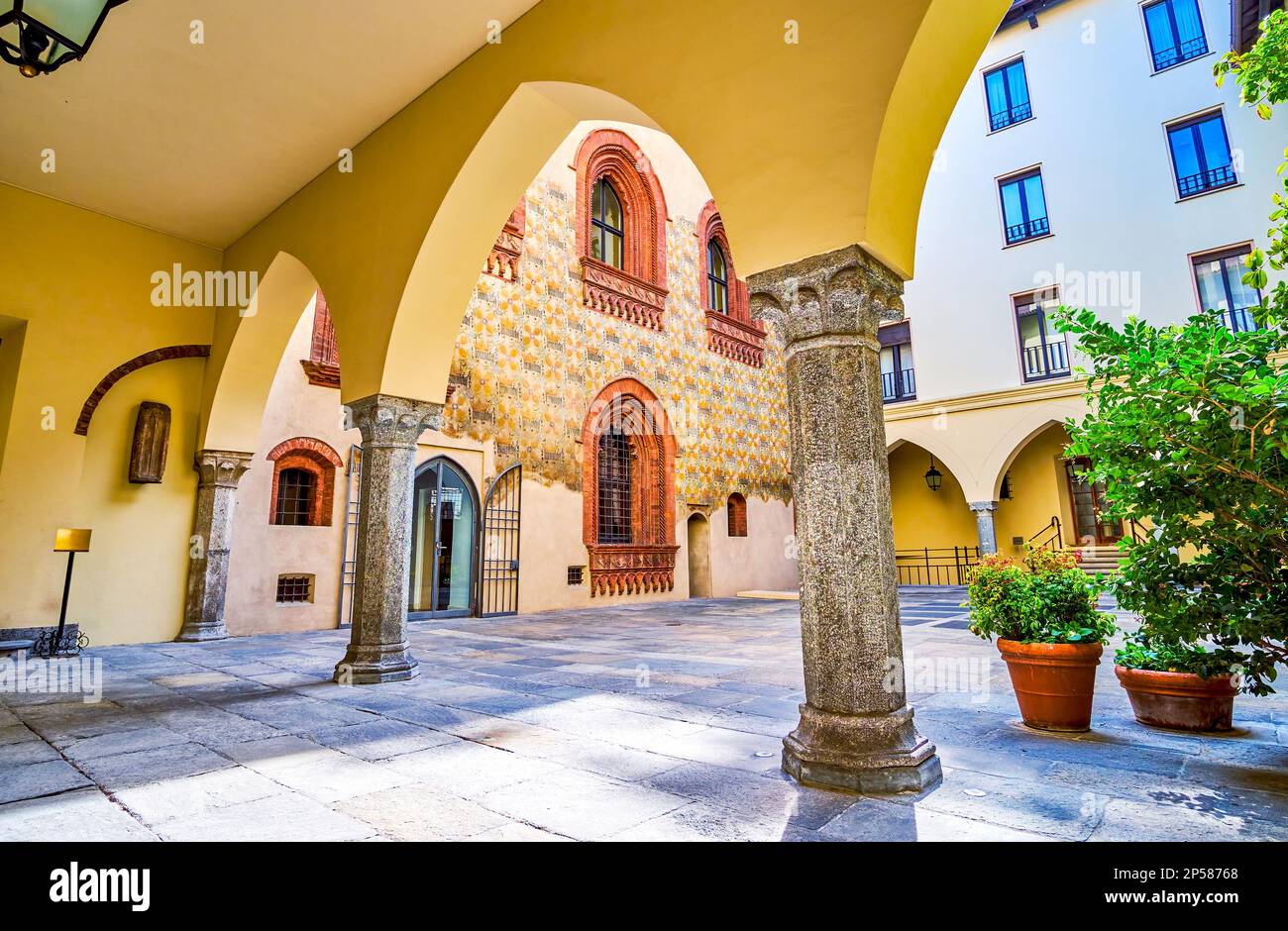 The arcades of the historic Palazzo Borromeo, leading the inner ...
