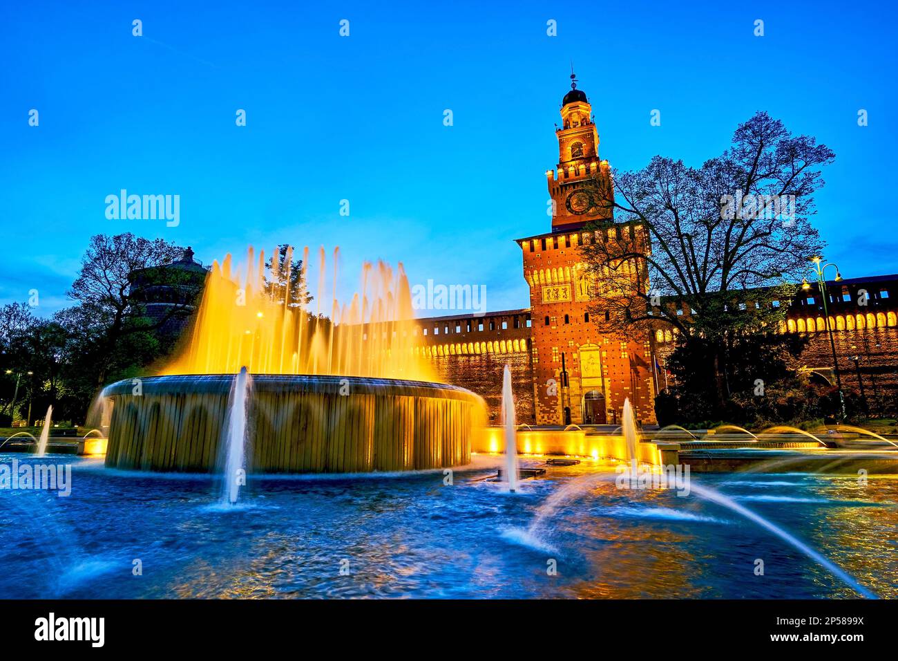The scenic illuminated fountain and the tower of Sforza's Castle on ...