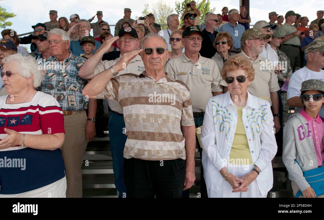 Bob Deuker, a retired Army Lt. Col. from Burton, salutes soldiers as ...