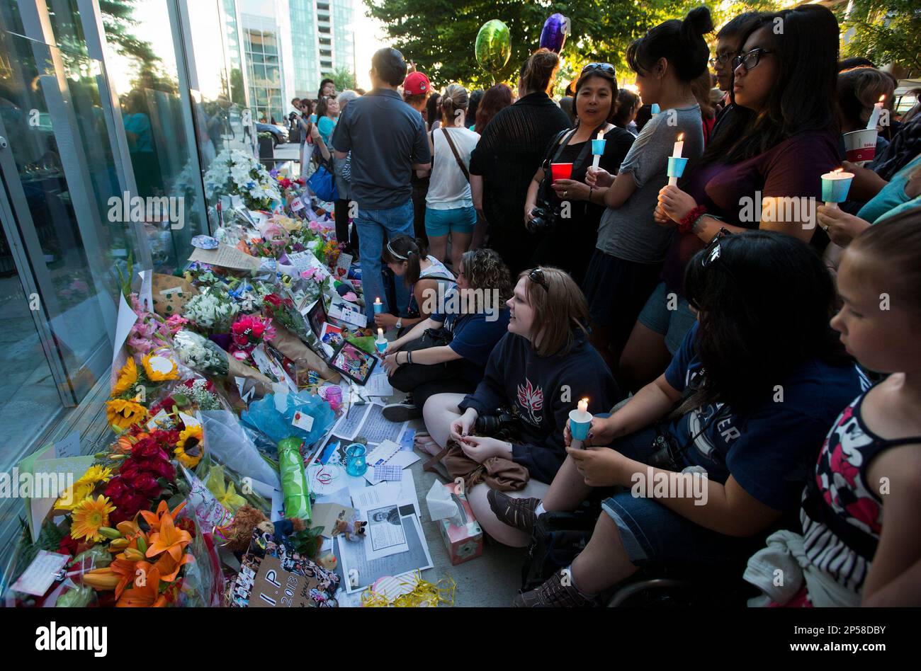 People gather at a memorial during a candlelight vigil for late actor ...