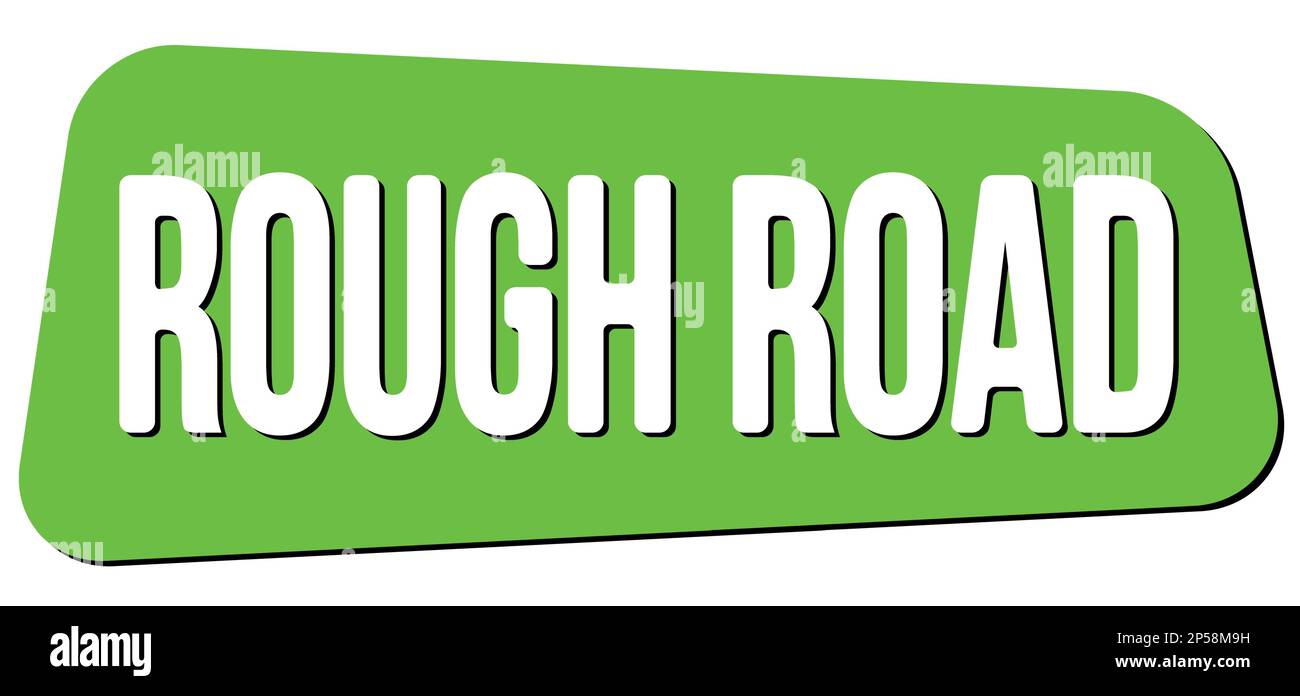 ROUGH ROAD text written on green trapeze stamp sign Stock Photo - Alamy