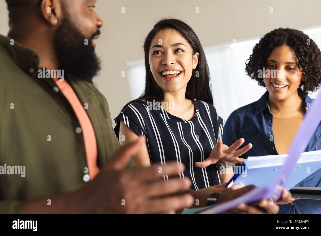 Happy diverse friends working together at home Stock Photo - Alamy