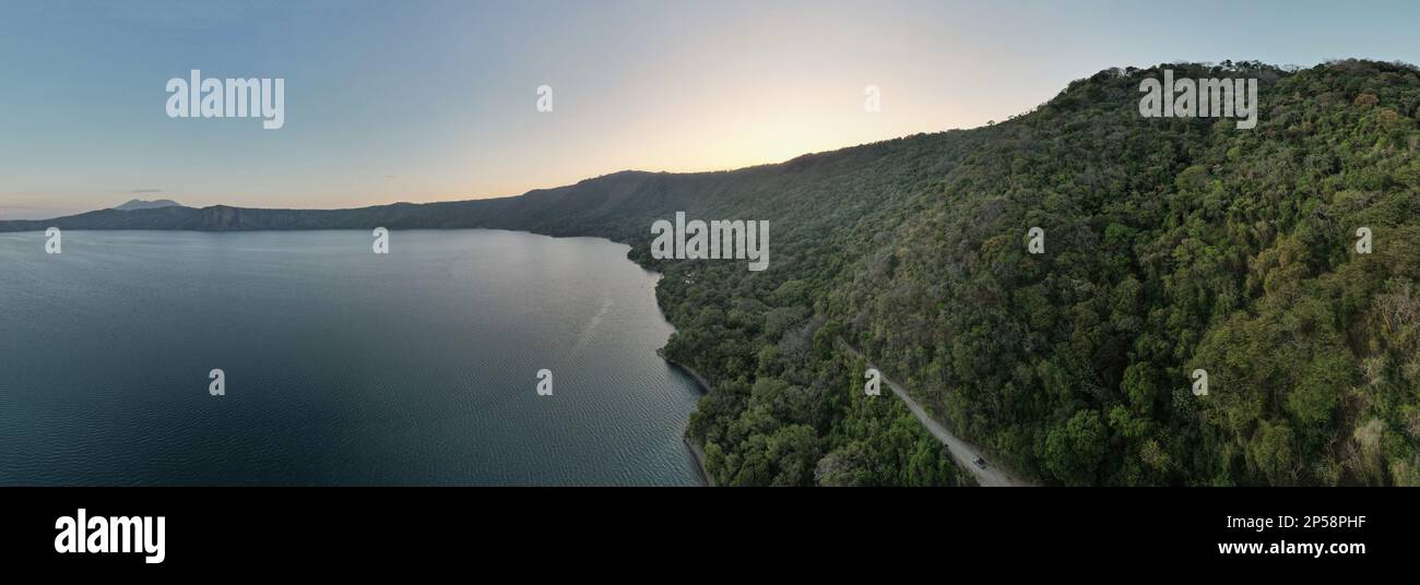 Volcano lagoon with green water on sunset light panorama view Stock ...