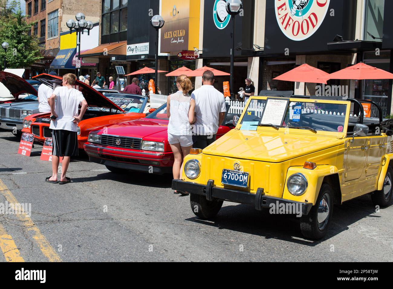 Cars line up Main Street during the Rolling Sculpture Car Show in ...