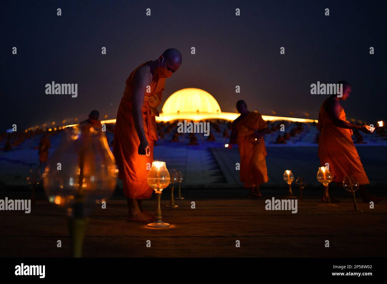 Thailand. 06th Mar, 2023. Thai monks light candles at Wat Phra ...