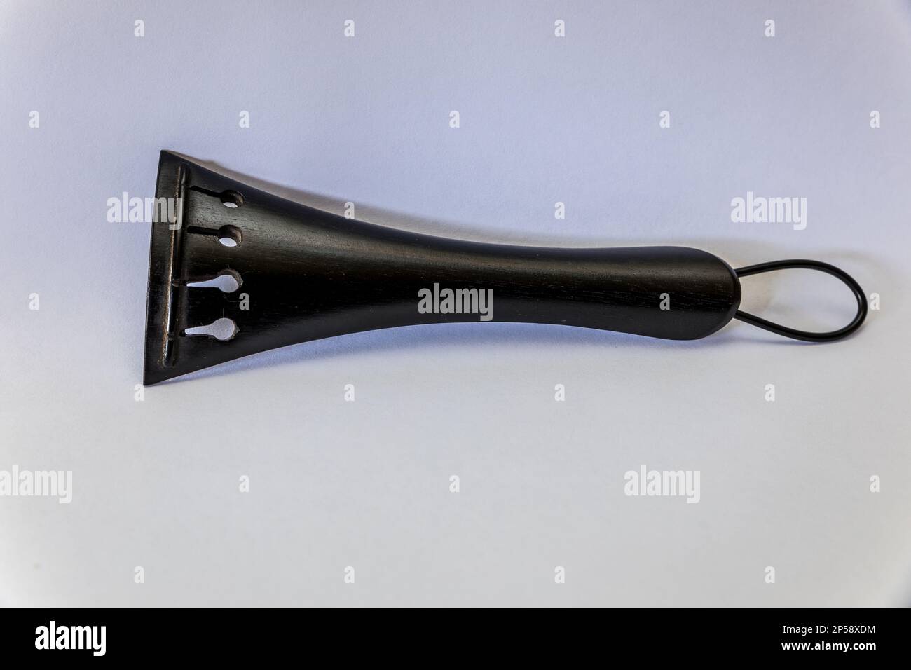 A 100 year old ebony Viola tailpiece Stock Photo - Alamy