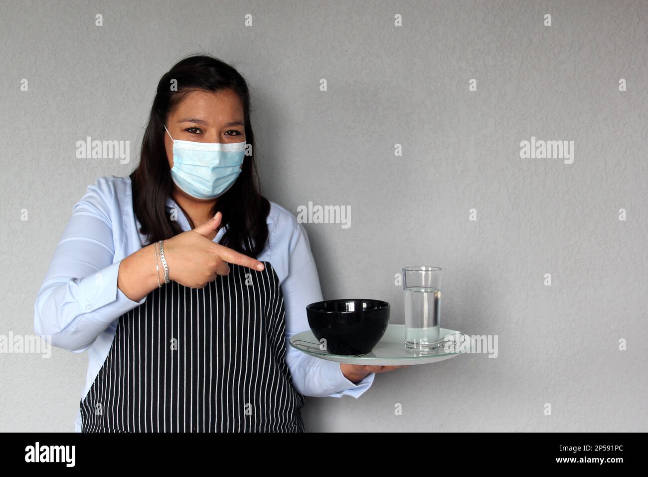 Latina waitress woman with protection mask and latex gloves working ...