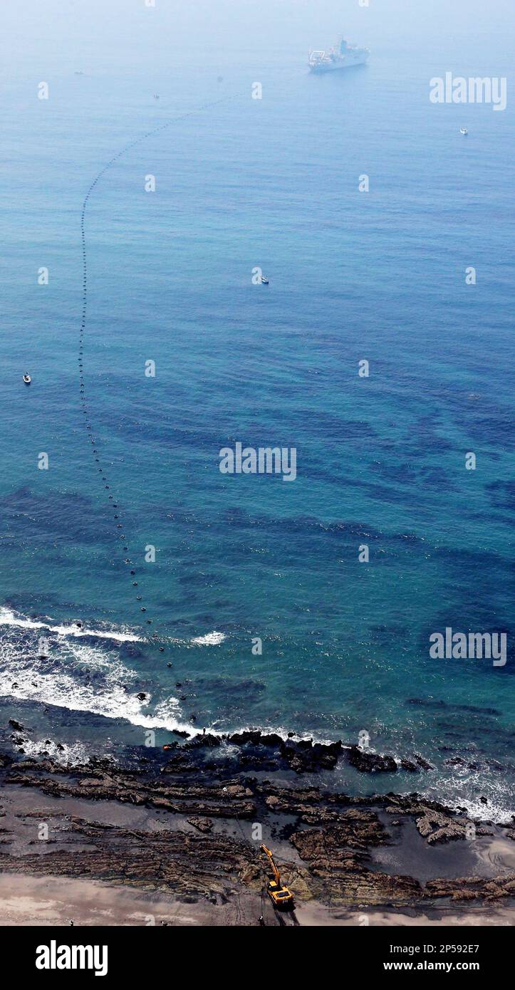 An aerial picture shows undersea seismometers and tsunami observation ...