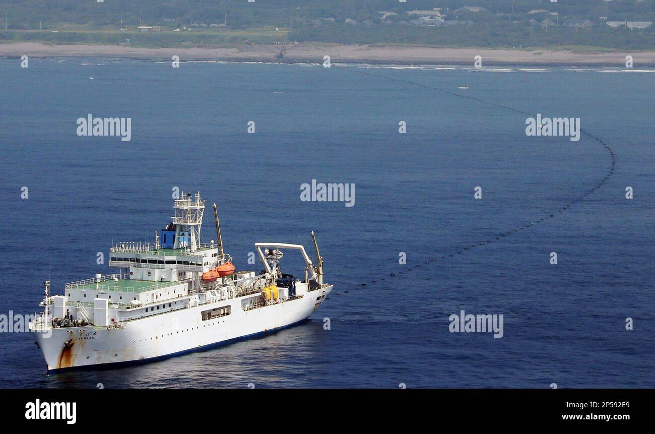 An aerial picture shows undersea seismometers and tsunami observation ...