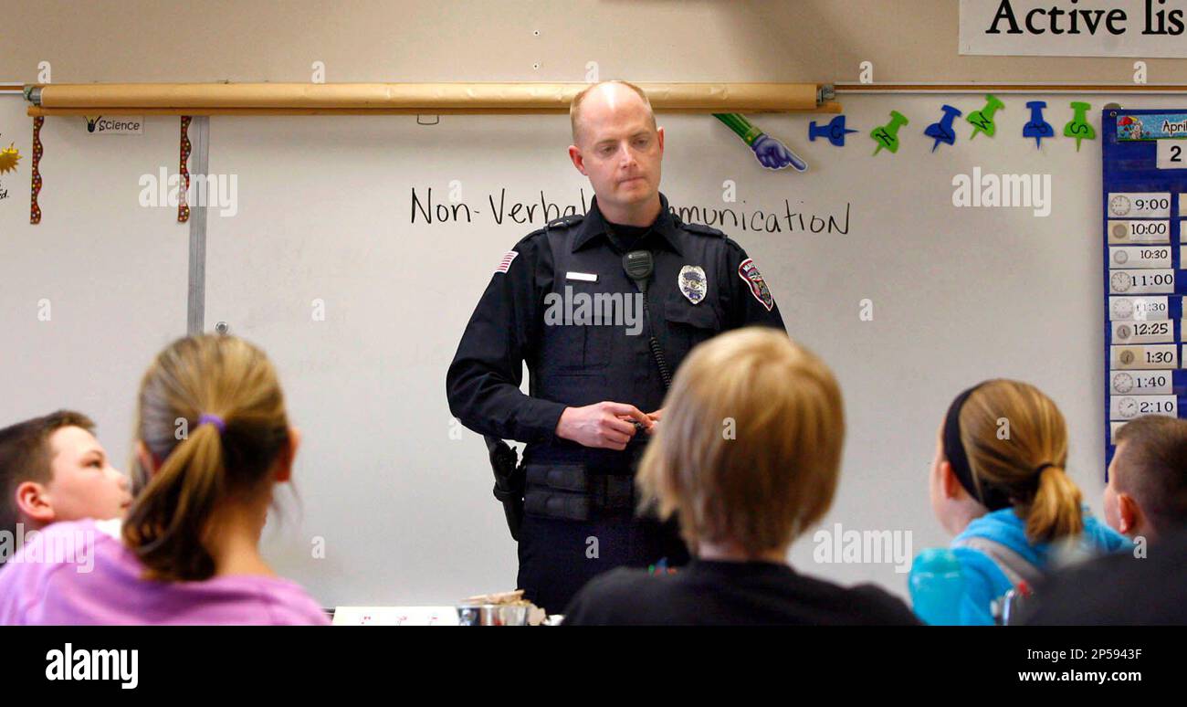Munster Police Officer James Ghrist talks with students during his DARE ...