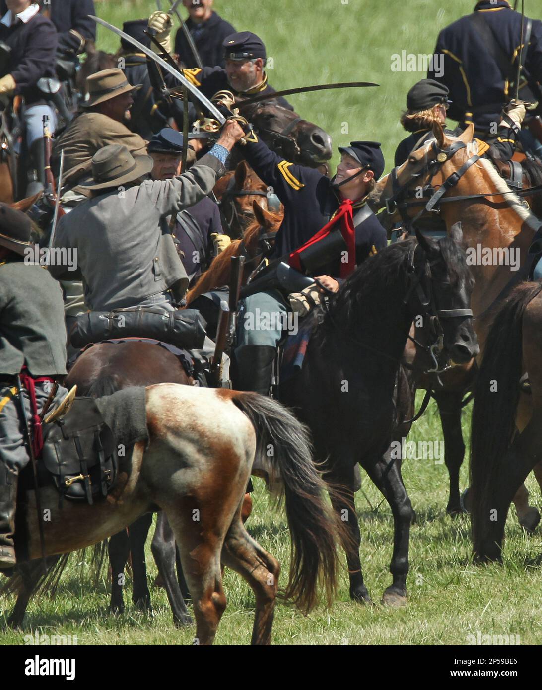 Union and Confederate cavalry reenactors clash with sabers during the ...