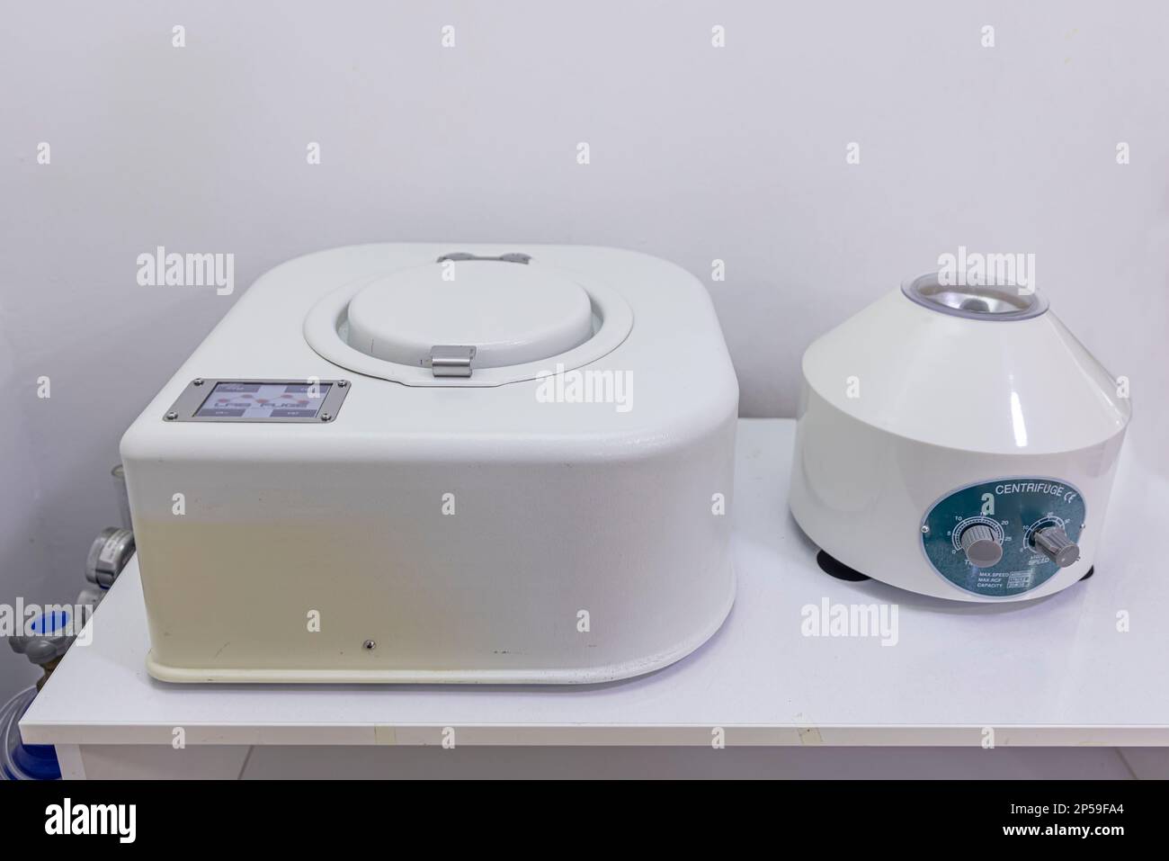 The blood tube is removed from the medical centrifuge for plasma ...