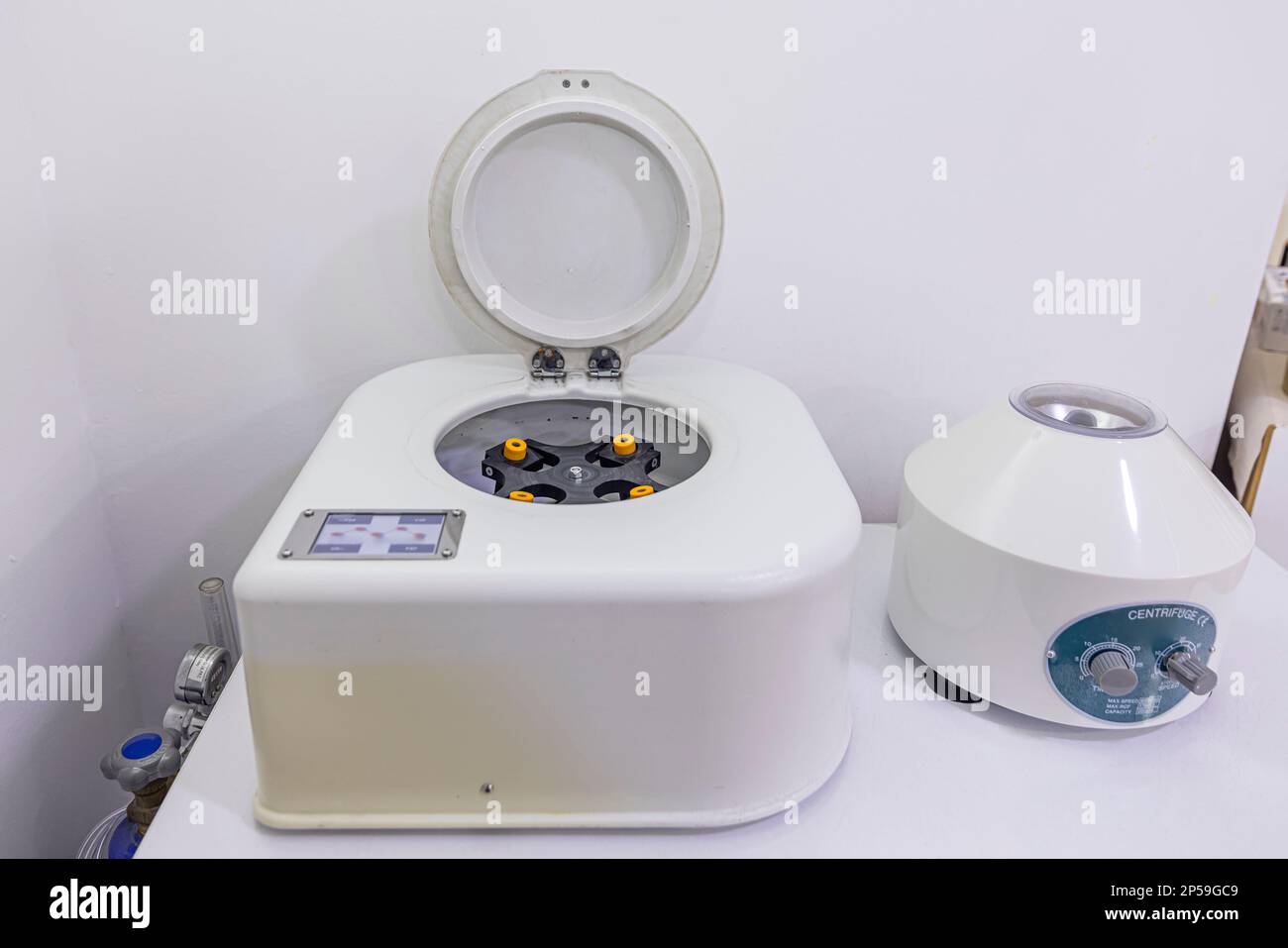 The blood tube is removed from the medical centrifuge for plasma ...