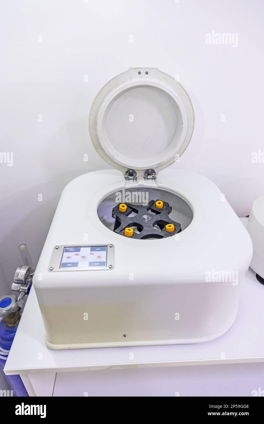 The blood tube is removed from the medical centrifuge for plasma ...