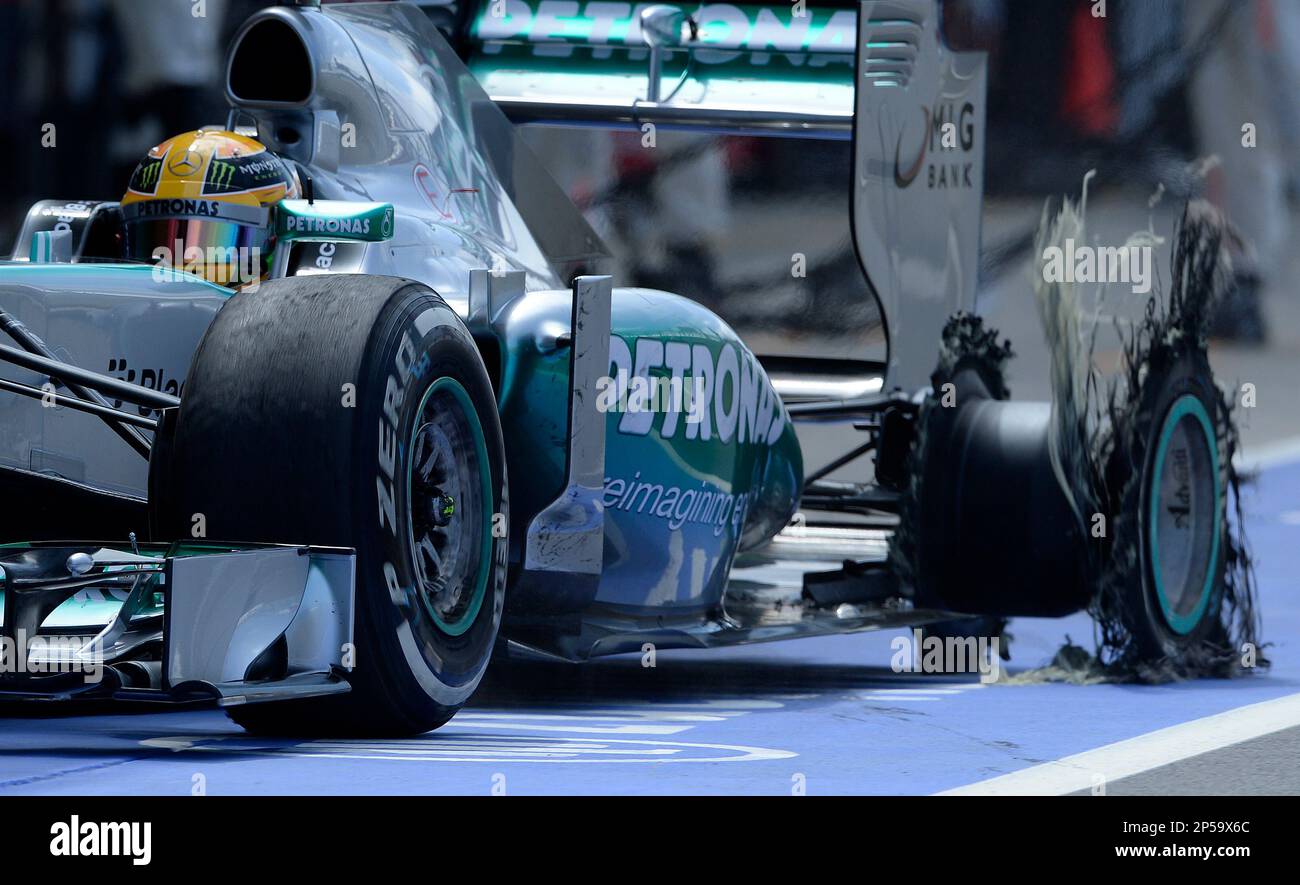 Mercedes Formula One driver Lewis Hamilton of Britain enters the pit ...