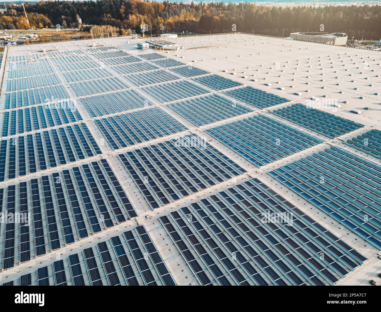 Solar panels stacked in lines on the roof top of distribution center ...