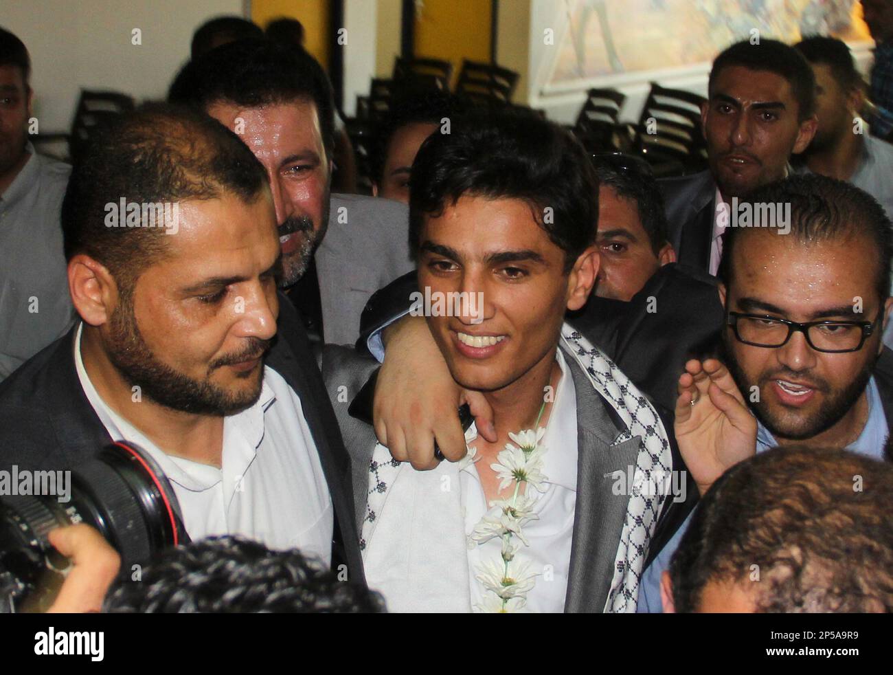 Arab Idol winner Palestinian Mohammed Assaf, center, arrives to the Rafah crossing point on the ...