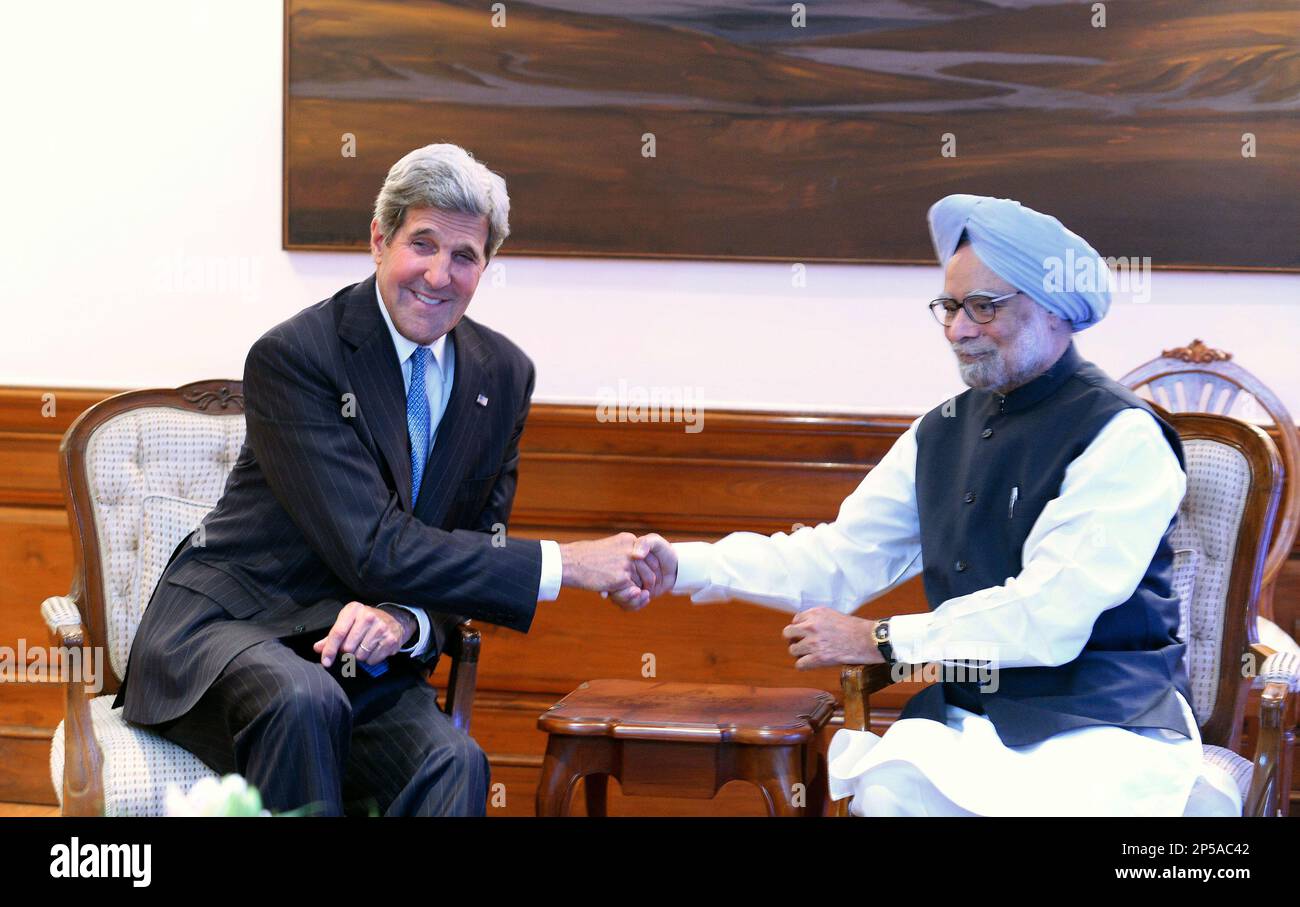 U.S. Secretary of State John Kerry, left, shakes hands with Indian ...