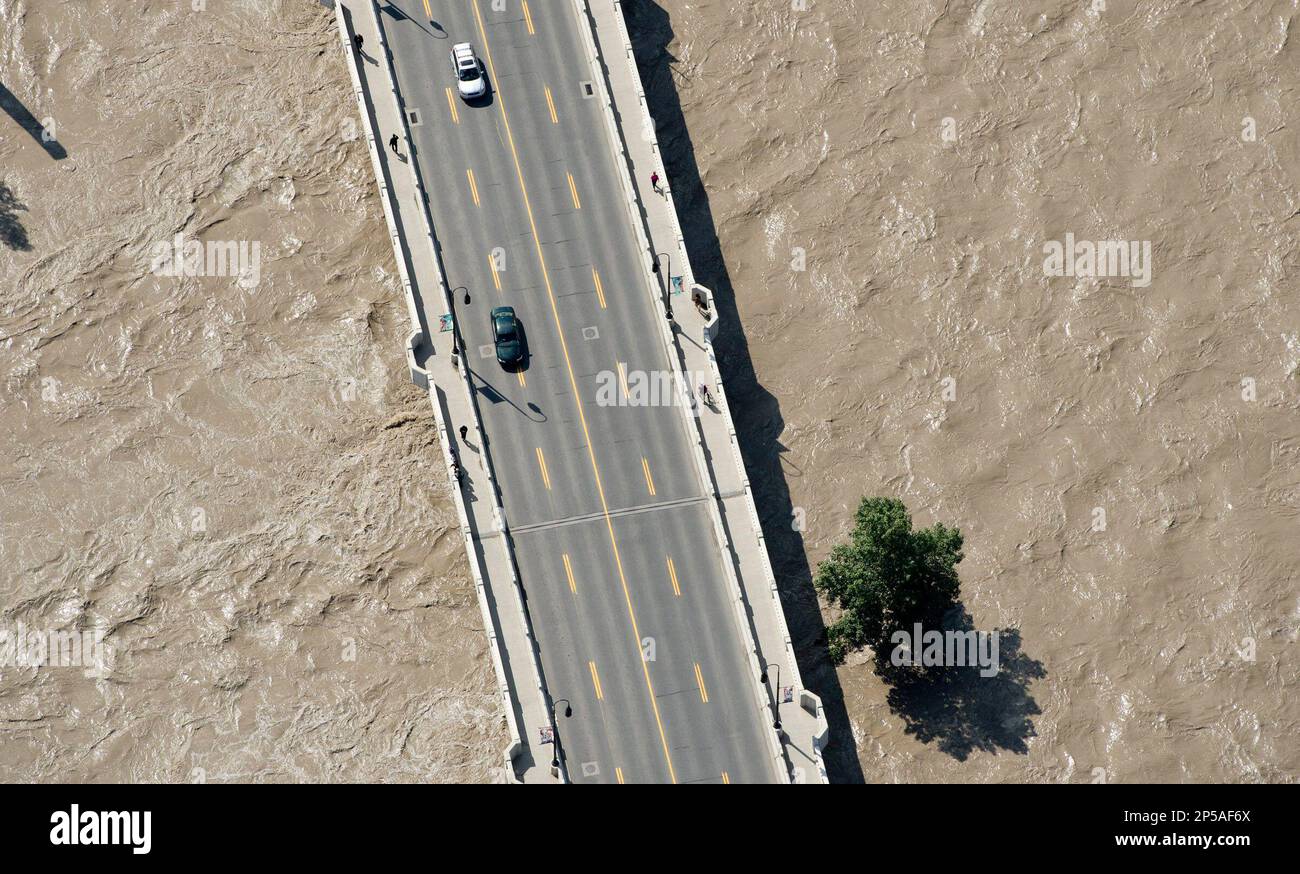 This aerial photo shows a flooded downtown Calgary, Alberta, Canada on ...