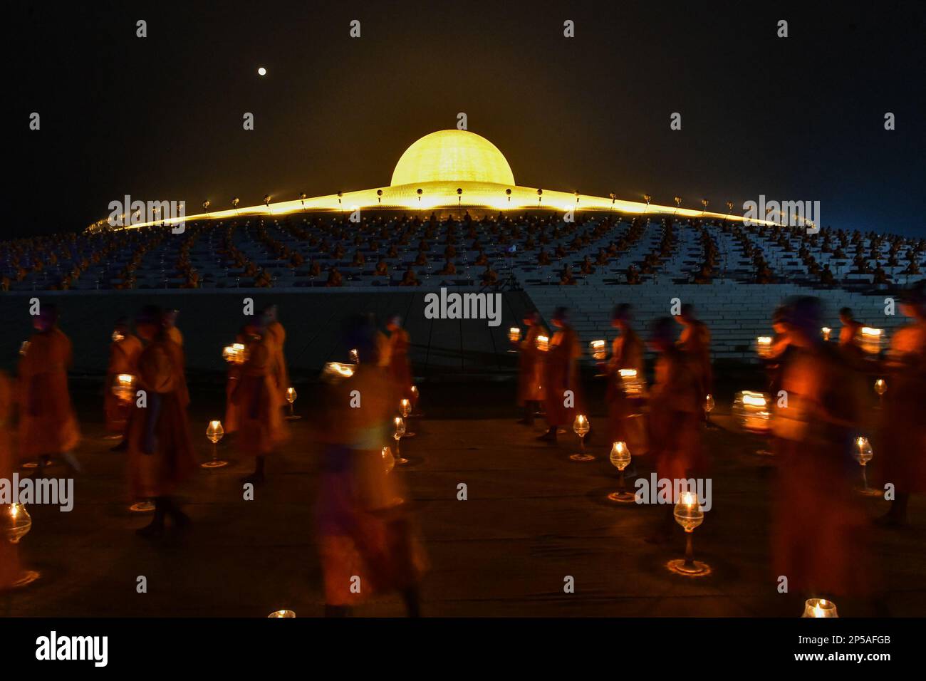 Thailand. 6th Mar, 2023. Thai monks hold a candle walk around Wat ...