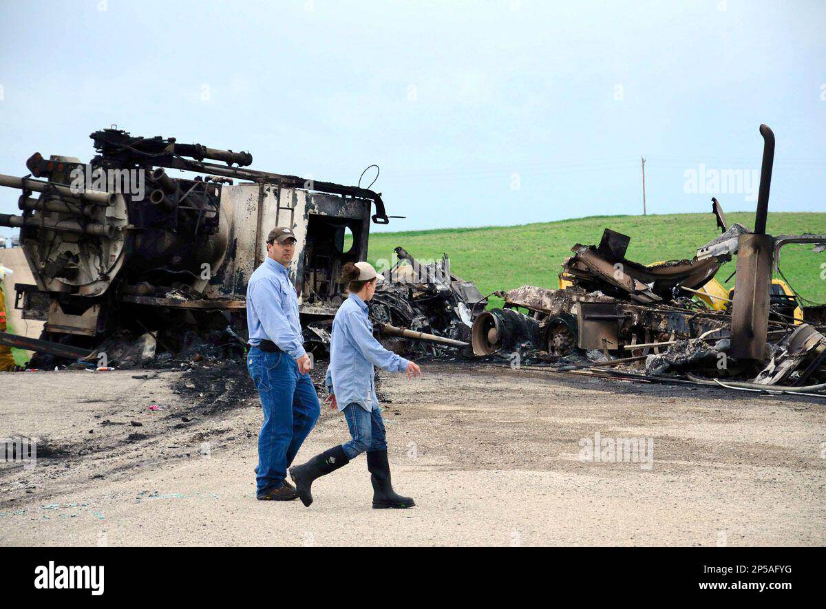 Emergency personnel survey the scene of a fiery crash on U.S. Highway 2 ...