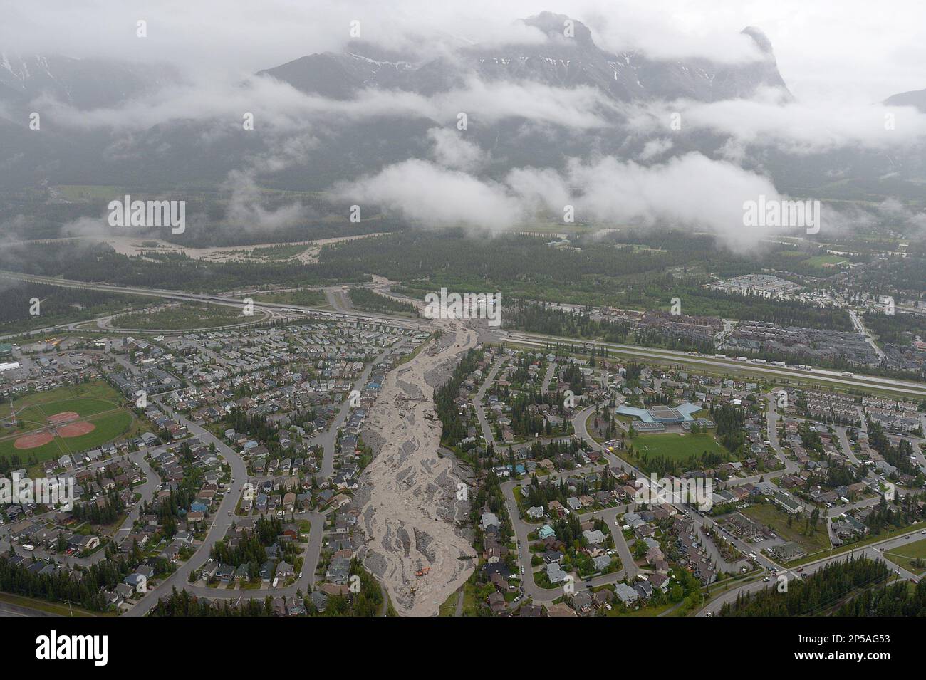 This aerial photo shows Cougar Creek running through Canmore, Alberta ...