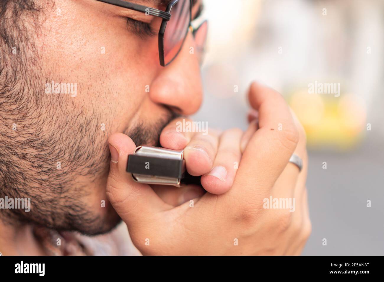 Portrait man playing harmonica hi-res stock photography and images - Alamy