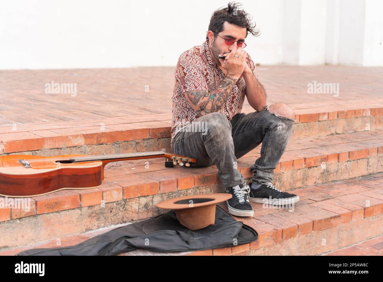 Portrait man playing harmonica hi-res stock photography and images - Alamy