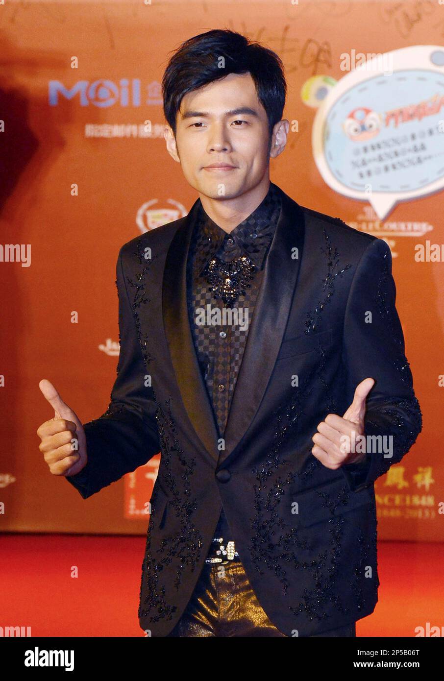 Taiwan singer-actor Jay Chou poses for photographers at the opening ...