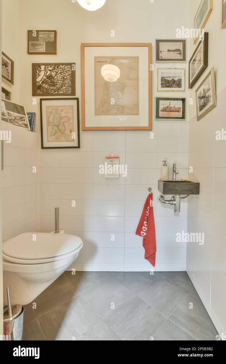 Amsterdam, Netherlands - 10 April, 2021: a bathroom with pictures on ...