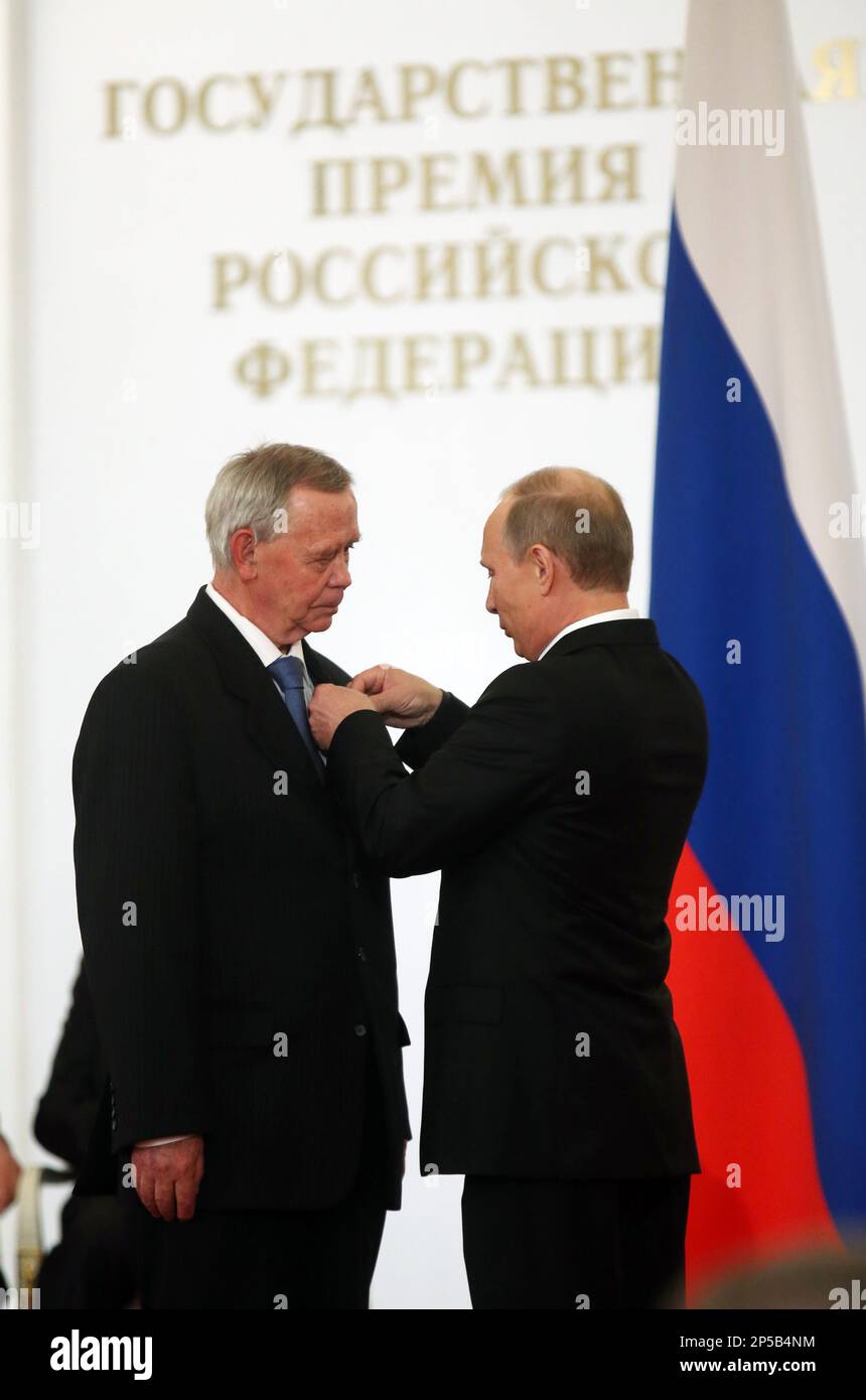 Russian President Vladimir Putin, right, awards Russian writer Valentin ...