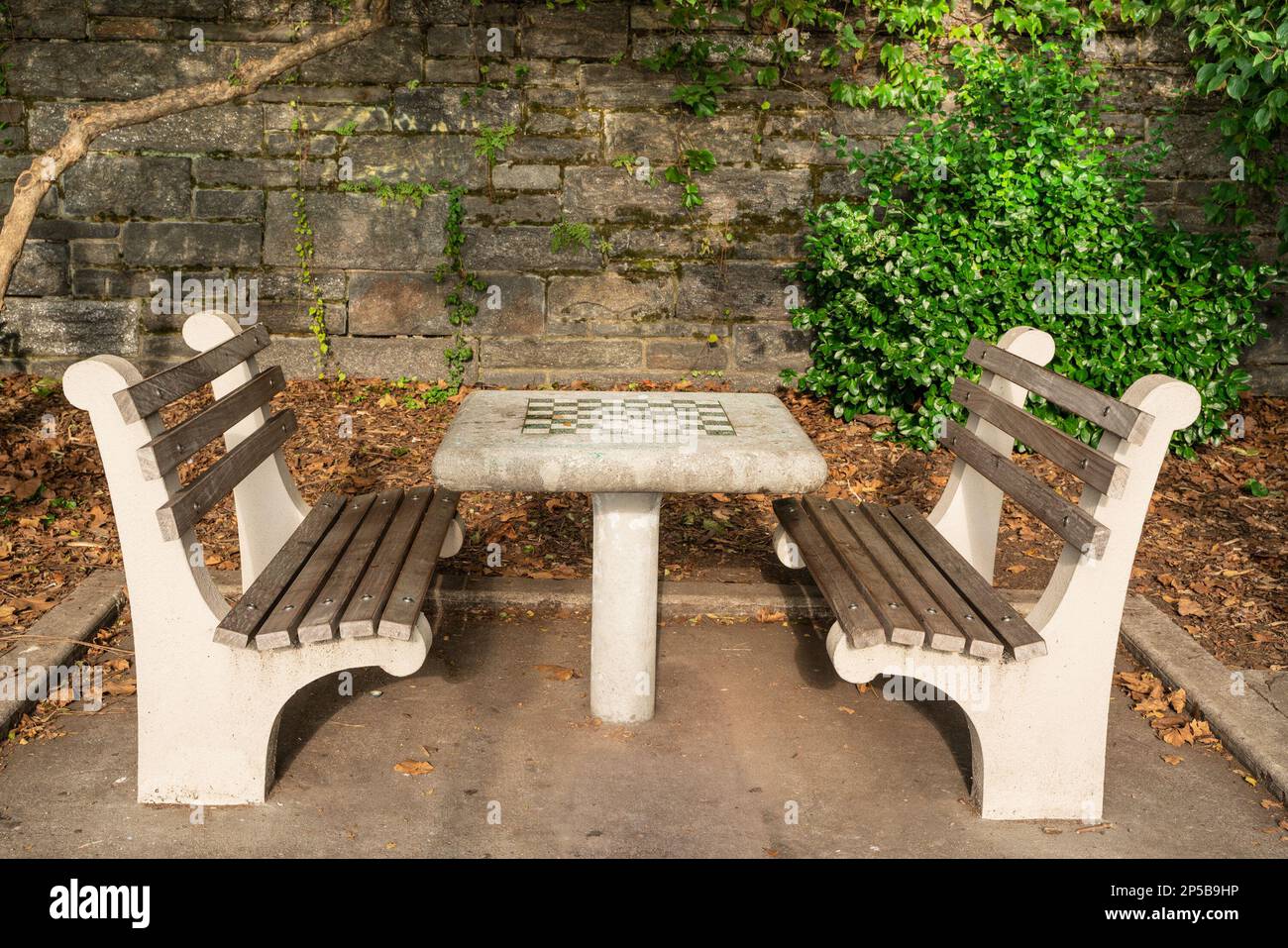 Outdoor chess checkerboard game with benches in park Stock Photo - Alamy