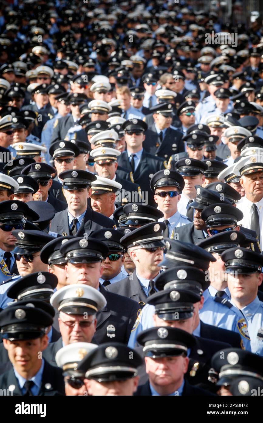 Emergency personnel take part in a memorial service honoring four ...