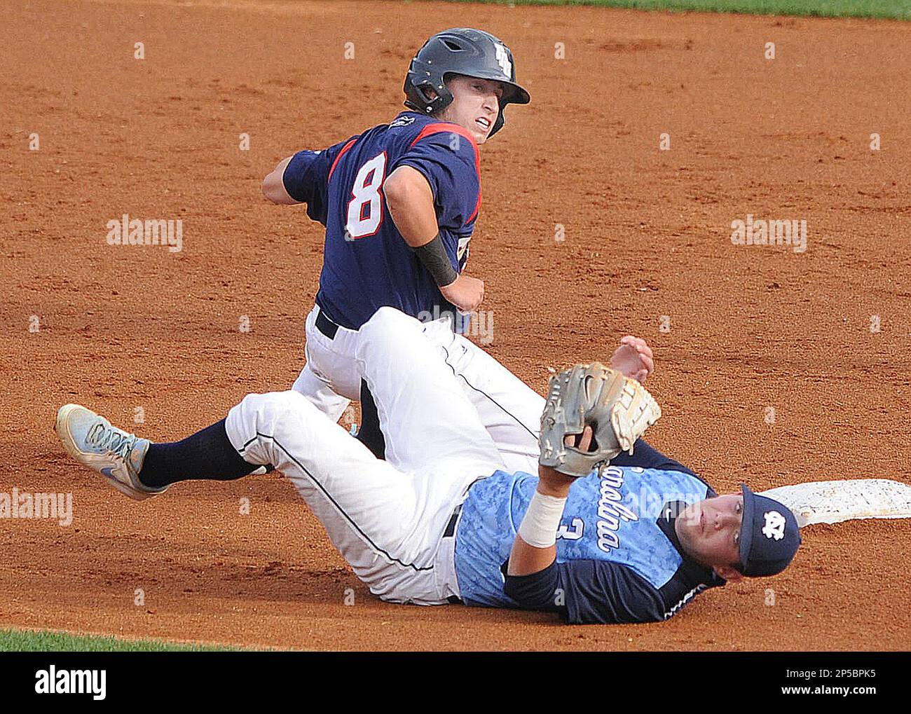 UNC's Mike Zolk tags out Florida Atlantic Geoff Jimenez (8) during a ...
