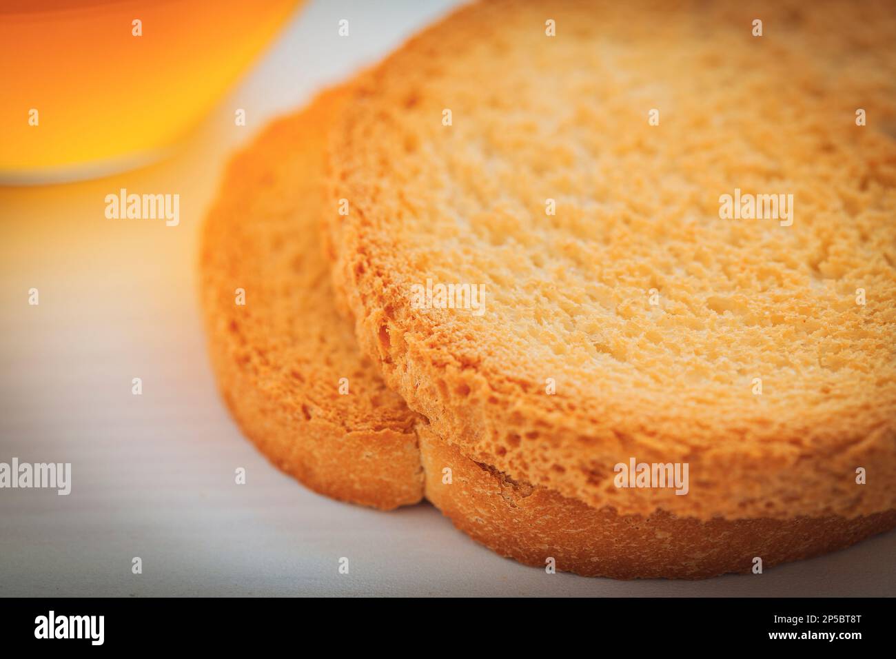 Rusks seasoned with honey pouring, typical morning breakfast Stock ...