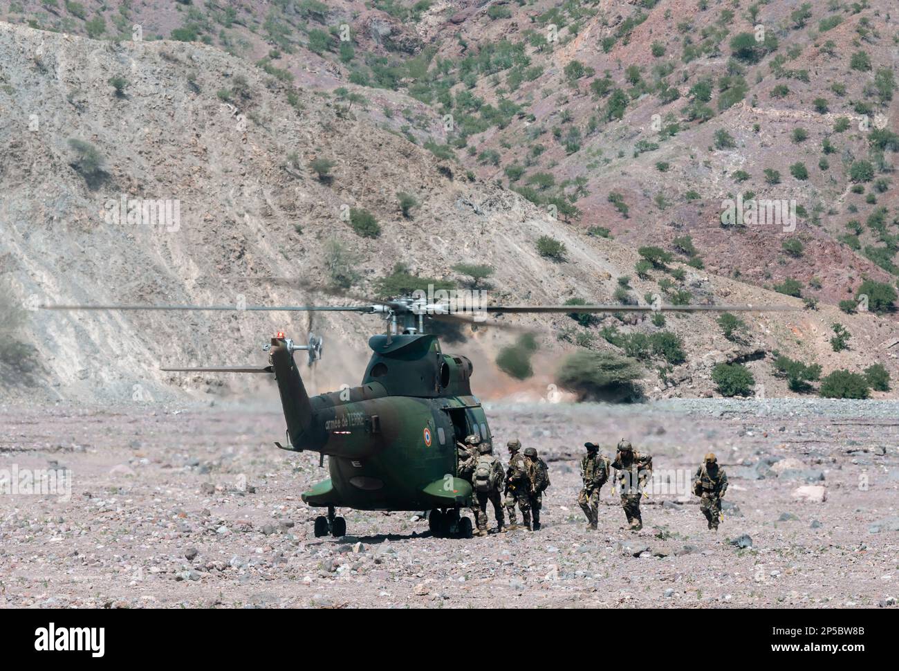 Members of the French Army load onto an Aerospatiale Gazelle during ...