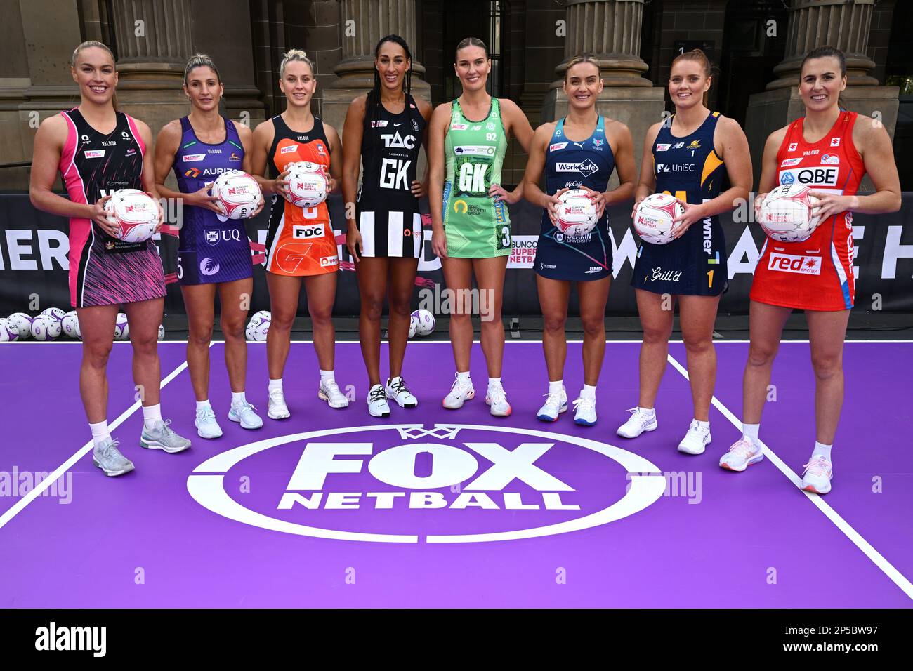 Representatives from all eight clubs pose for a photo during the Super ...