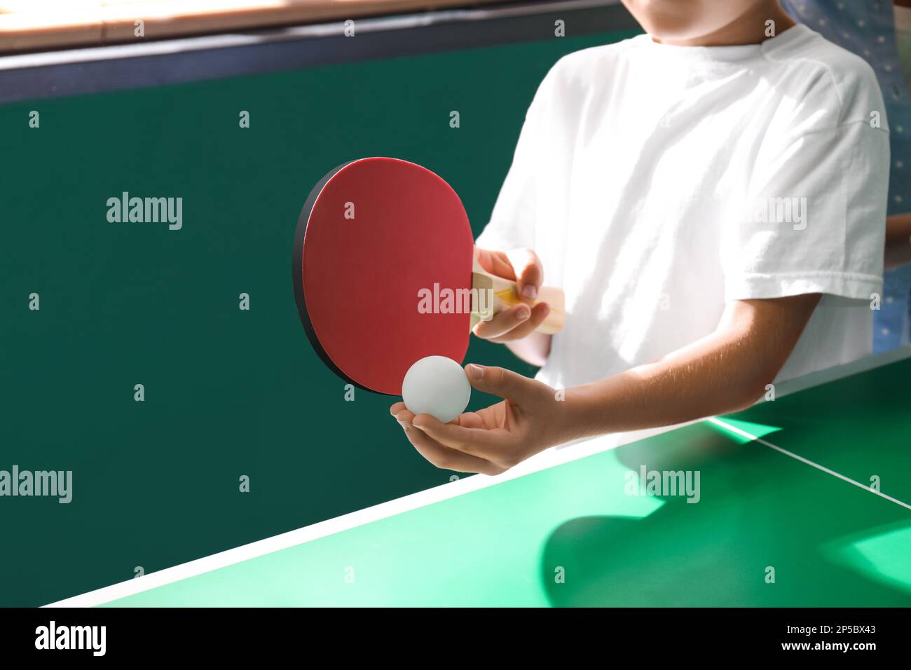 Little boy playing ping pong indoors, closeup Stock Photo - Alamy