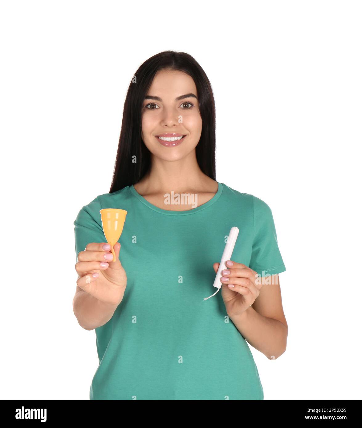 Young woman with menstrual cup and tampon on white background Stock ...