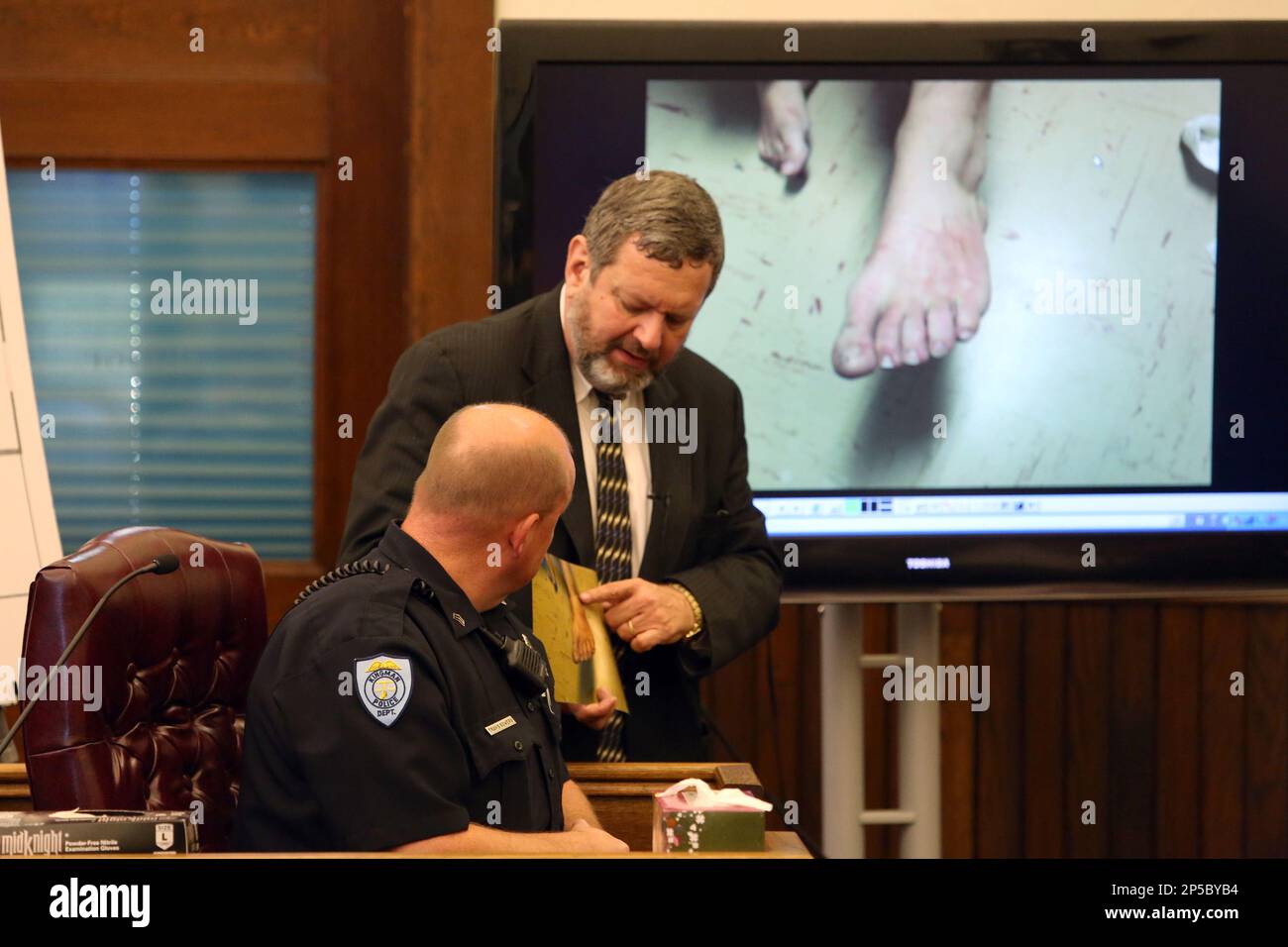 Defense attorney Roger Falk questions Kingman Police Sgt. Travis Sowers ...