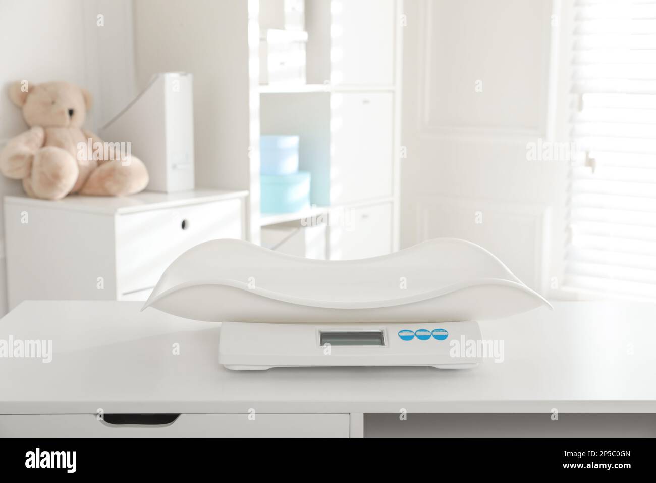 Modern digital baby scales on table in clinic Stock Photo - Alamy