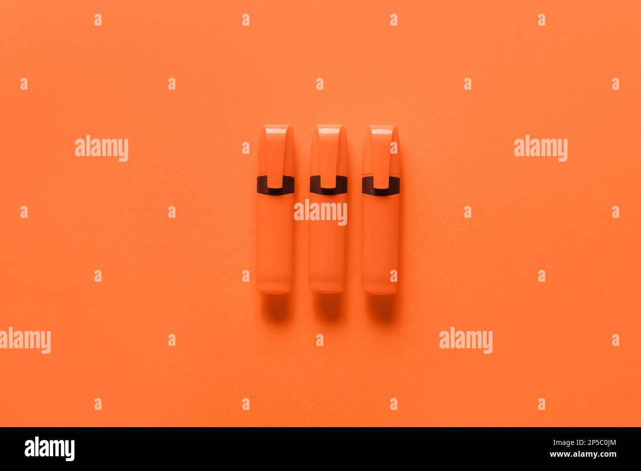 Permanent markers on orange background Stock Photo - Alamy