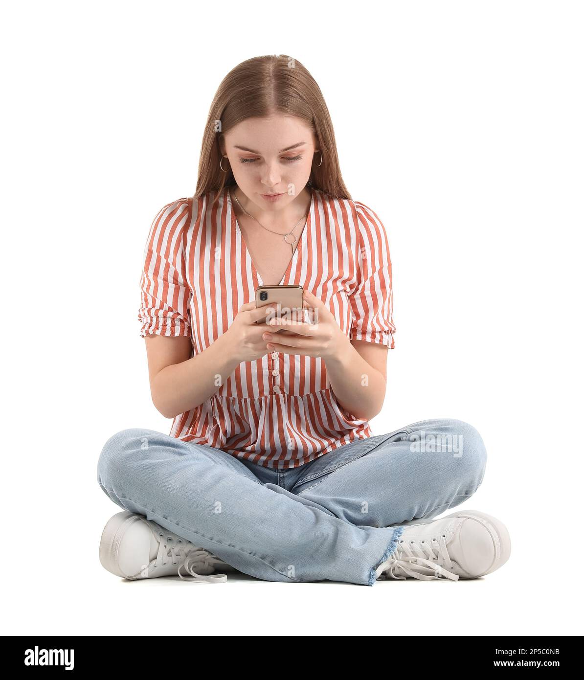 Beautiful girl using mobile phone on white background Stock Photo - Alamy