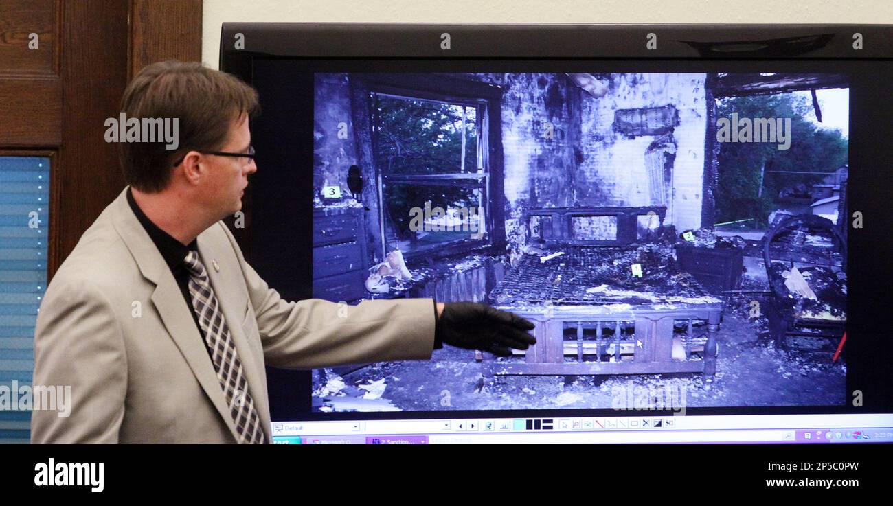 KBI agent Brian Carroll shows the placards that were placed inside the ...