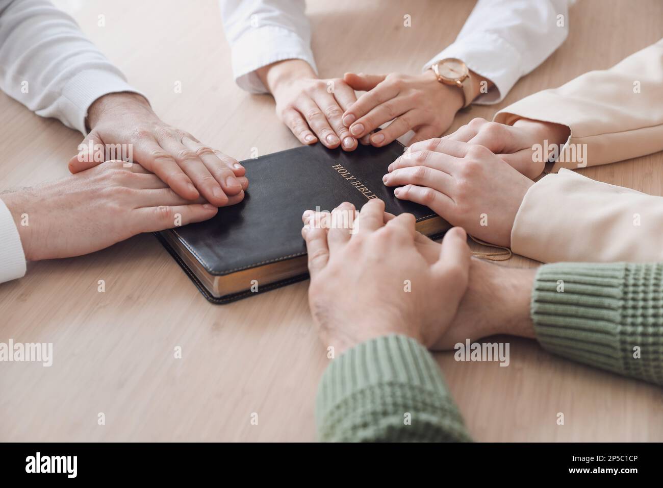 Group business people praying together hi-res stock photography and ...